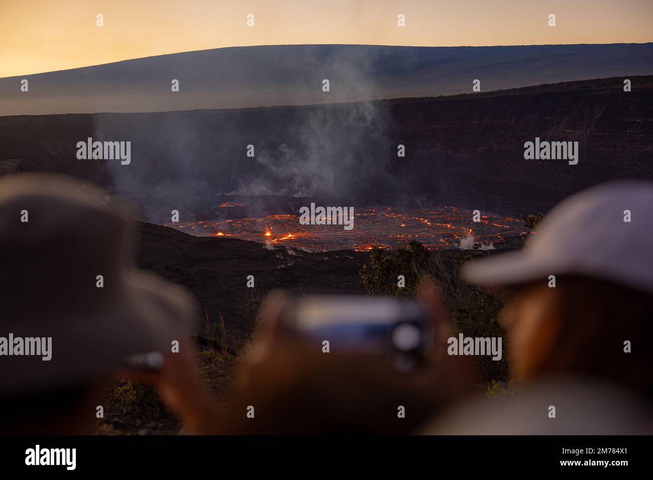 Volcano, HI, USA. 7th Jan, 2023. Spectators observe the eruption ...