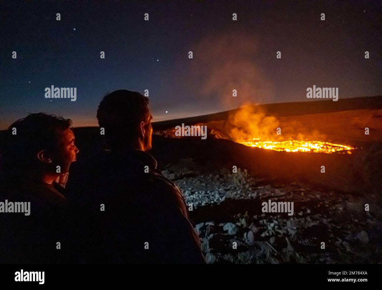 Volcano, HI, USA. 7th Jan, 2023. Spectators observe the eruption ...