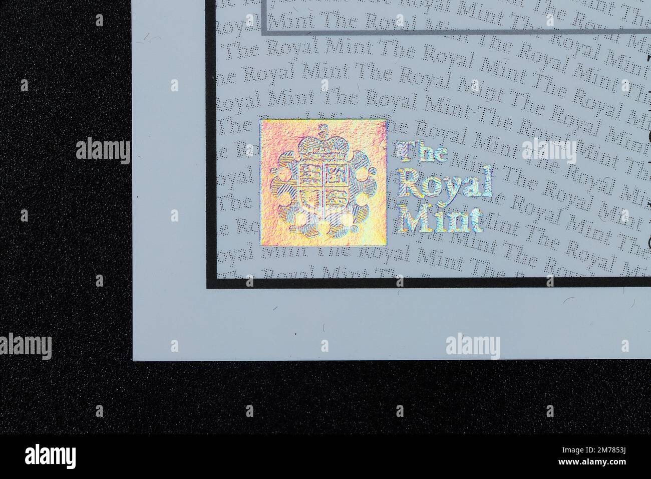 A hologram of The Royal Mint printed on a genuine purchase of the 2015 annual coin set Stock ...