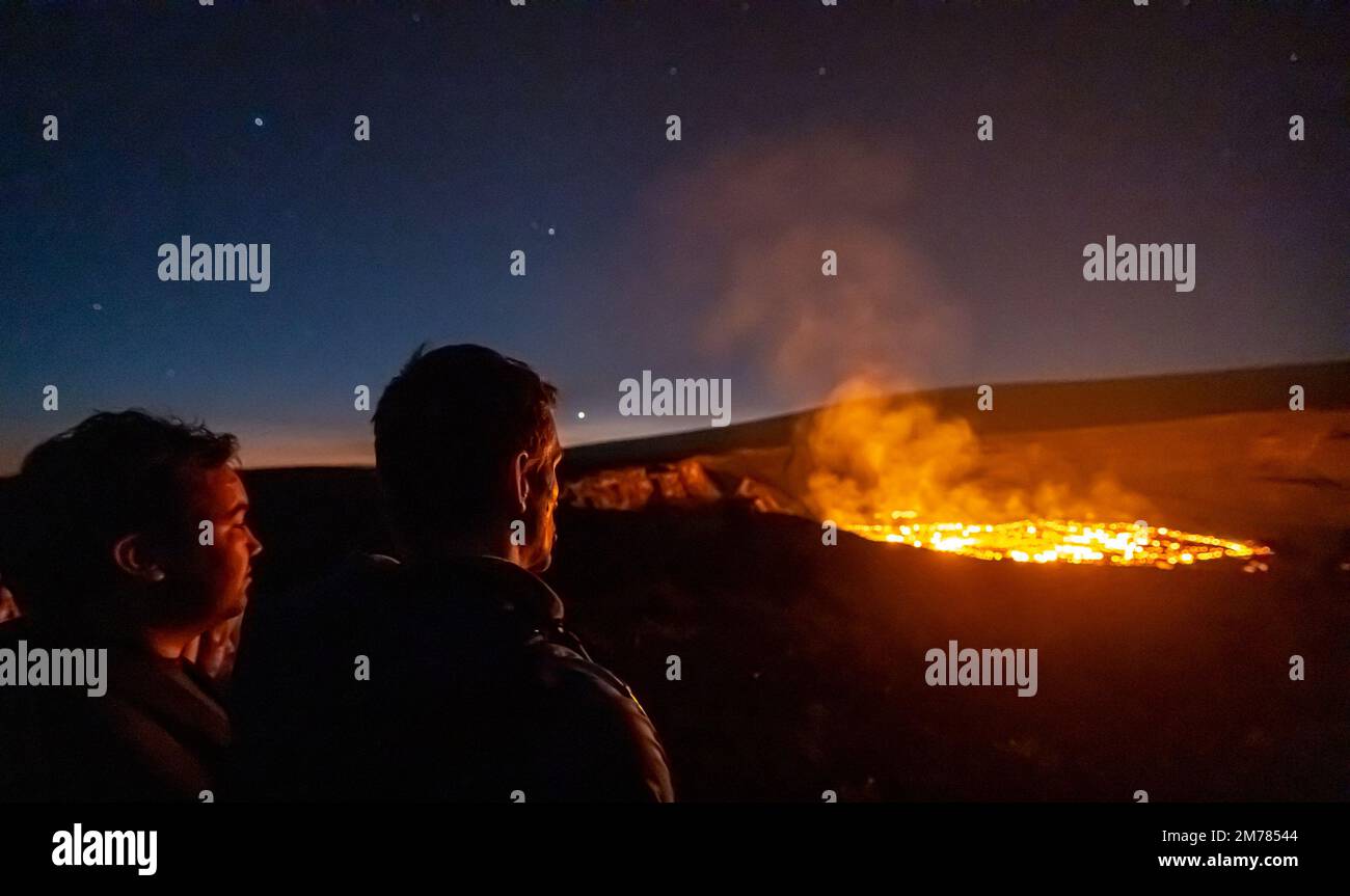 Volcano, HI, USA. 7th Jan, 2023. Spectators observe the eruption ...