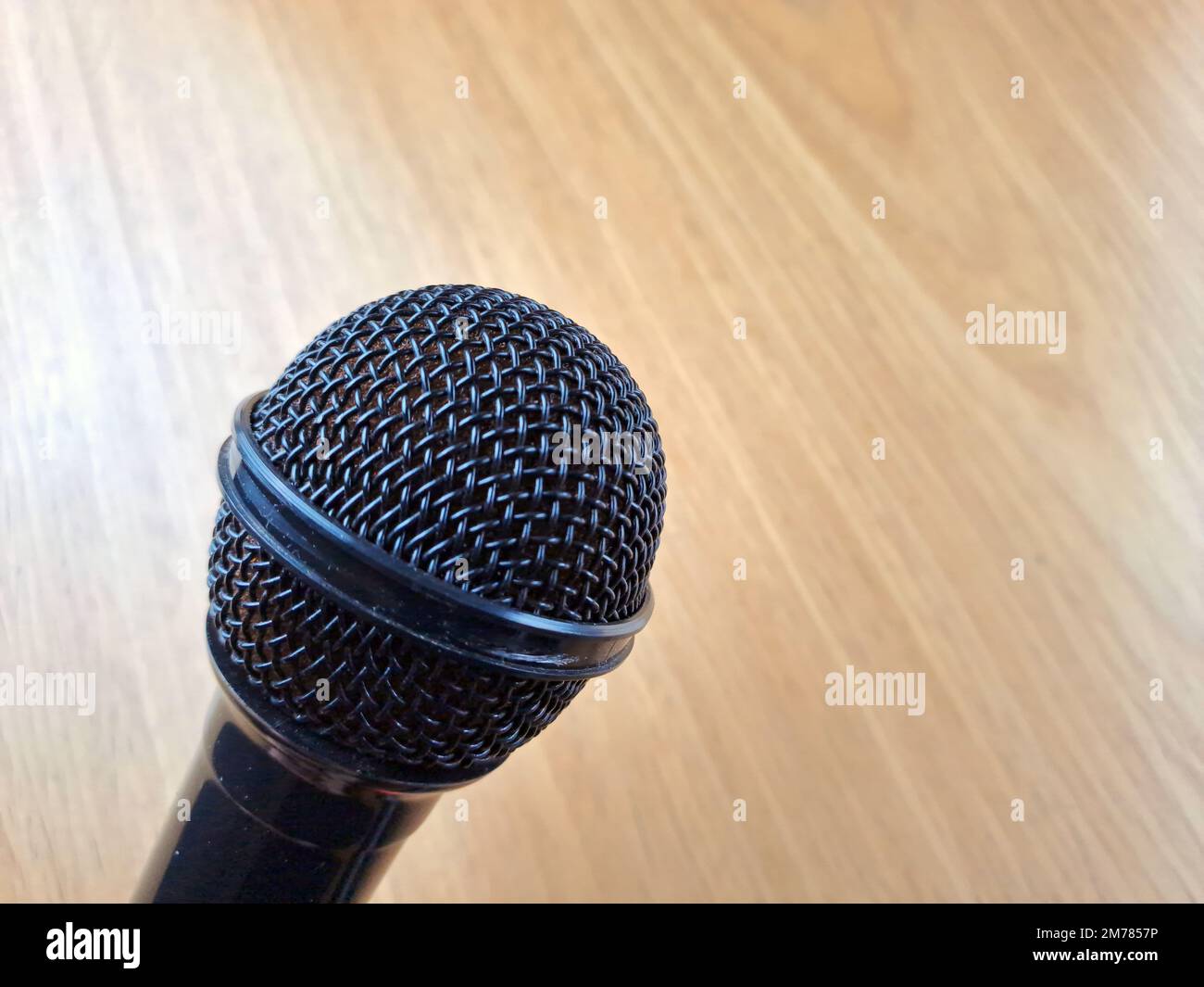 Microphone Close-up Isolated, wood color background Stock Photo - Alamy