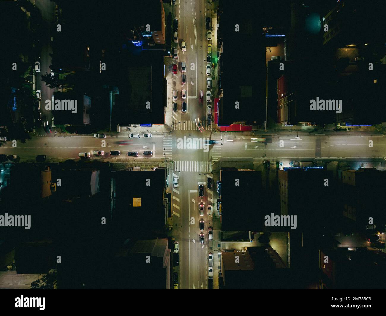 night view of a road busy with cars regulated by a roundabout. the slow ...