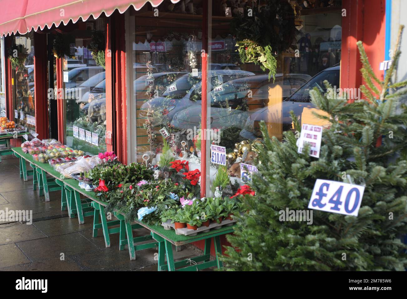 A seasonal Christmas fruit and vegetable shop frontage with Christmas ...