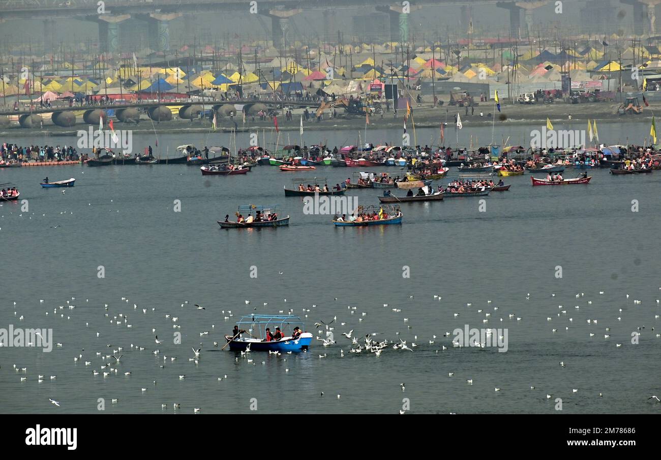 INDIA, PRAYAGRAJ, 8th JANUARY : Devotees take a boat ride on the river ...