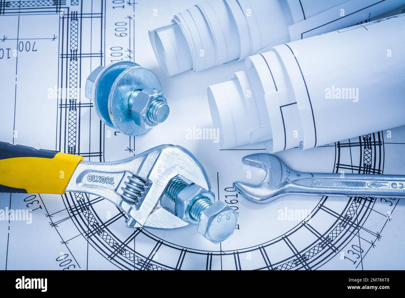 Adjustable key spanner bolts nuts and blueprints construction concept ...