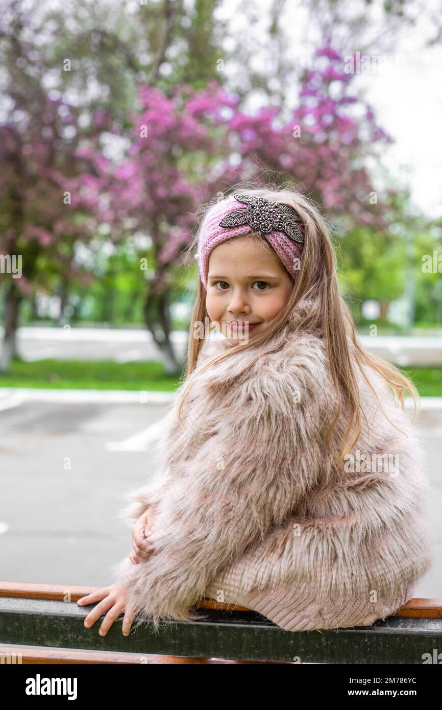 toddler pretty girl sitting on the bench. High quality photo Stock ...