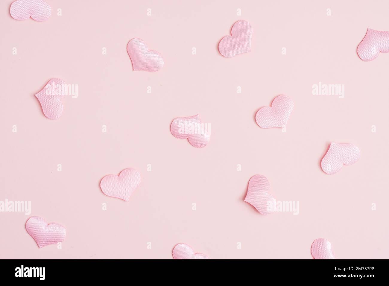 Background pattern pink heart on peach colored paper Stock Photo - Alamy