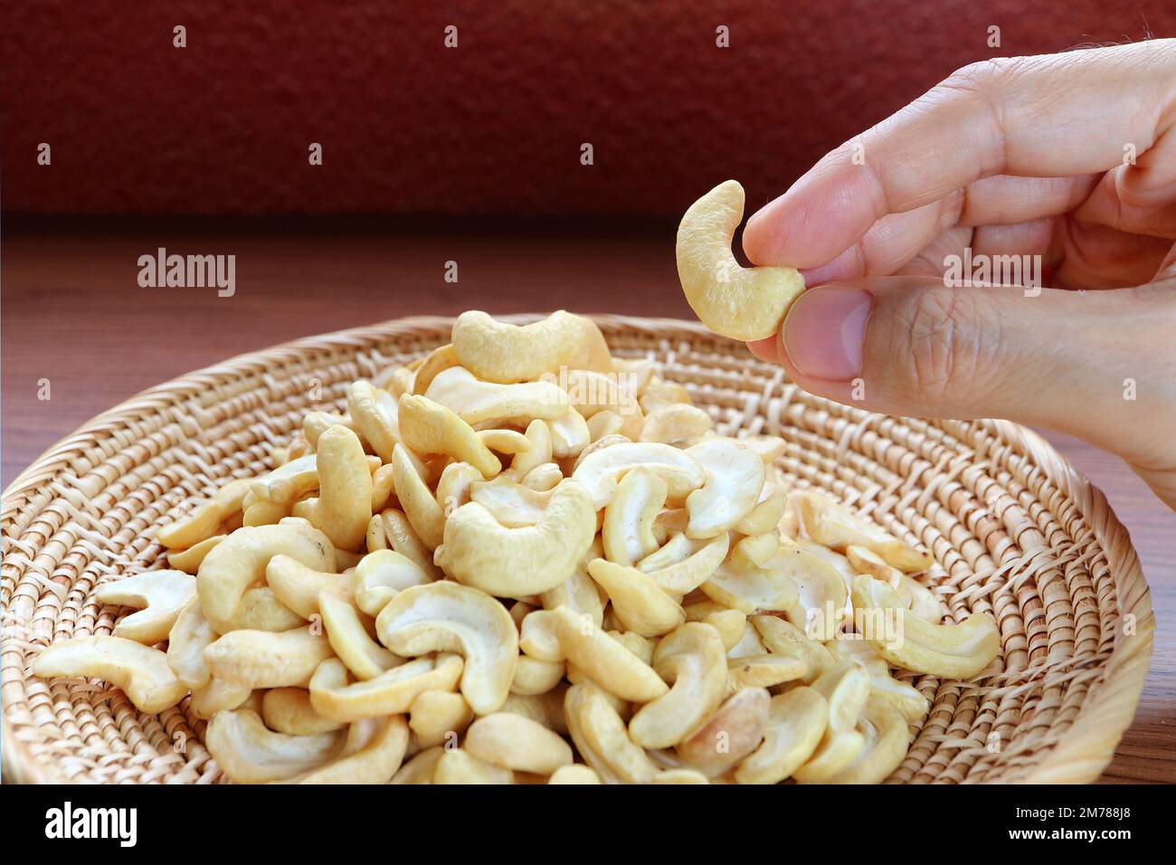 Hand Picking a Dried Cashew Nut Kernels from Its Pile Stock Photo - Alamy