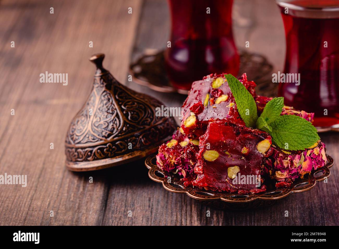 Traditional Turkish Delight with glass of tea, selective focus Stock ...