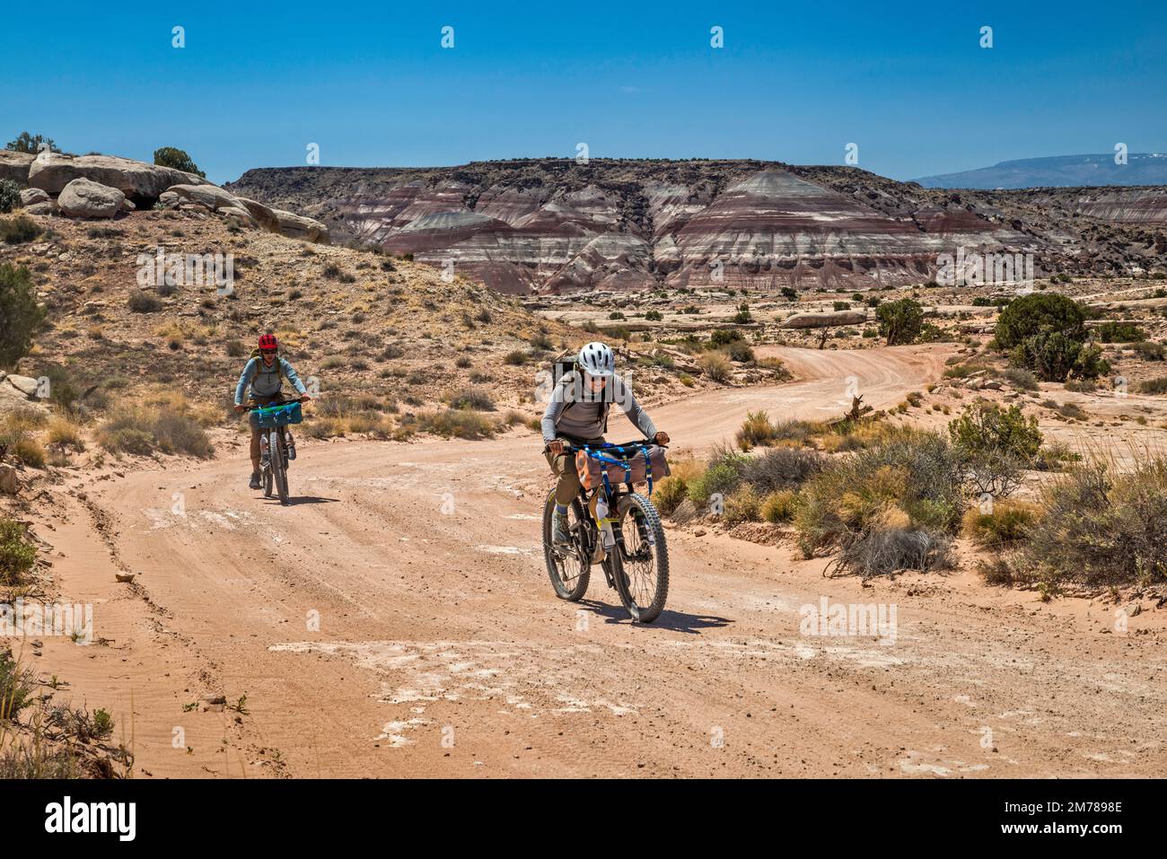 Bikers on Cathedral Valley Road crossing Caineville Wash, Middle Desert ...