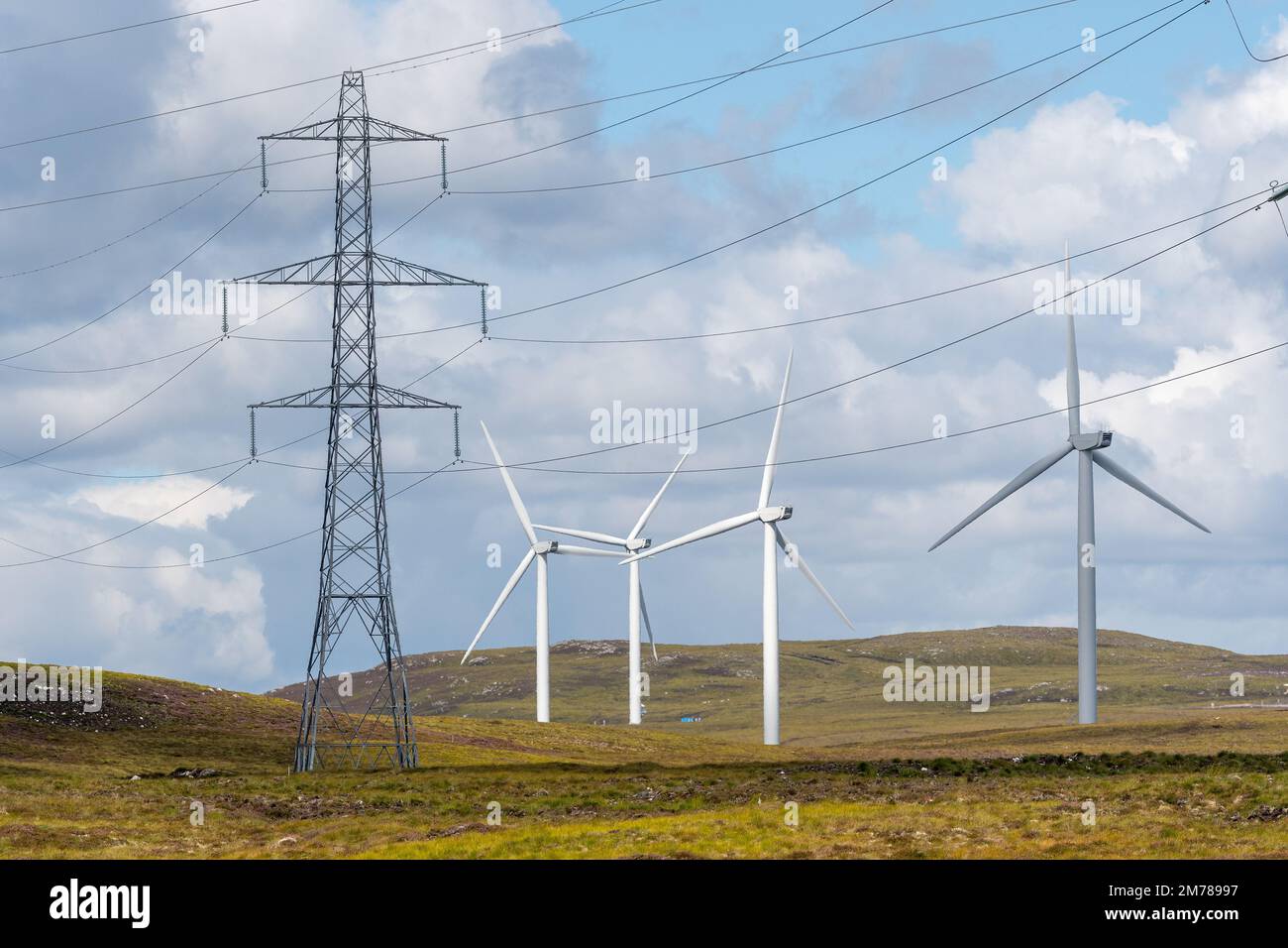 Electricity powerlines marching across a Scottish moor, with Wind ...