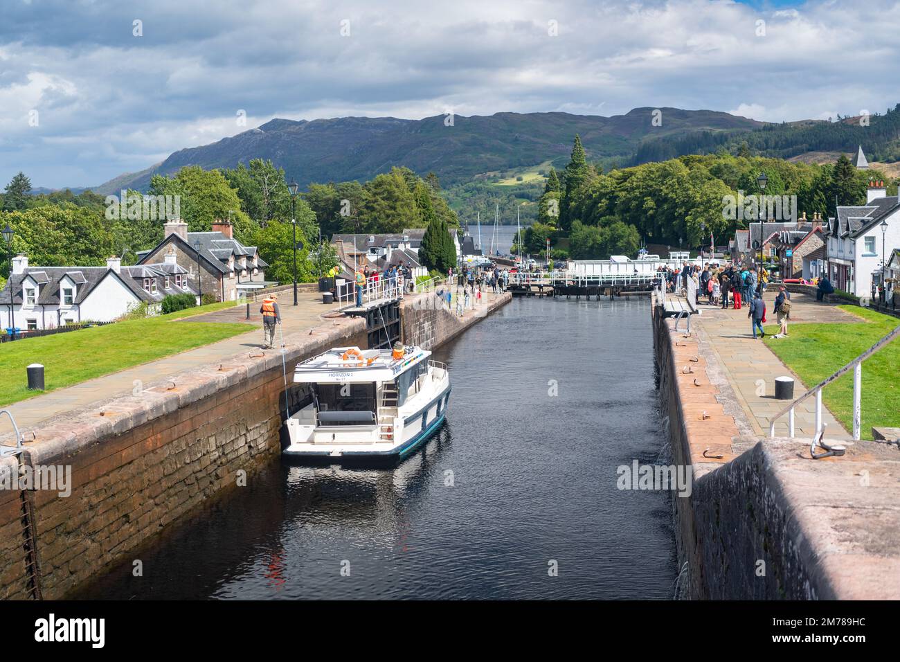 Leisure boat going through Locks on the Caledonian Canal at Fort ...