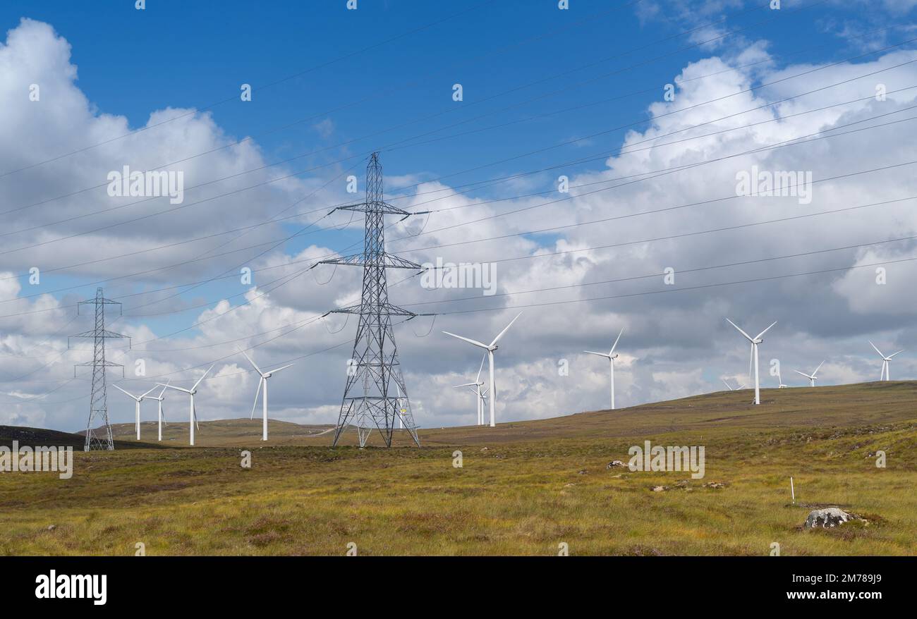 Electricity powerlines marching across a Scottish moor, with Wind ...