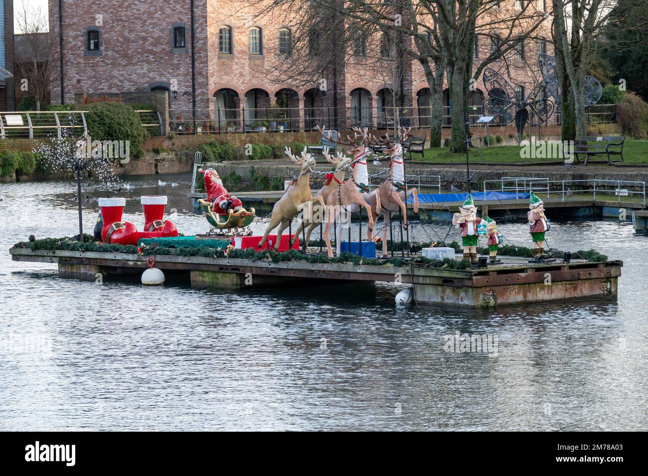 Father Christmas on his sleigh on Chichester Canal West Sussex England ...