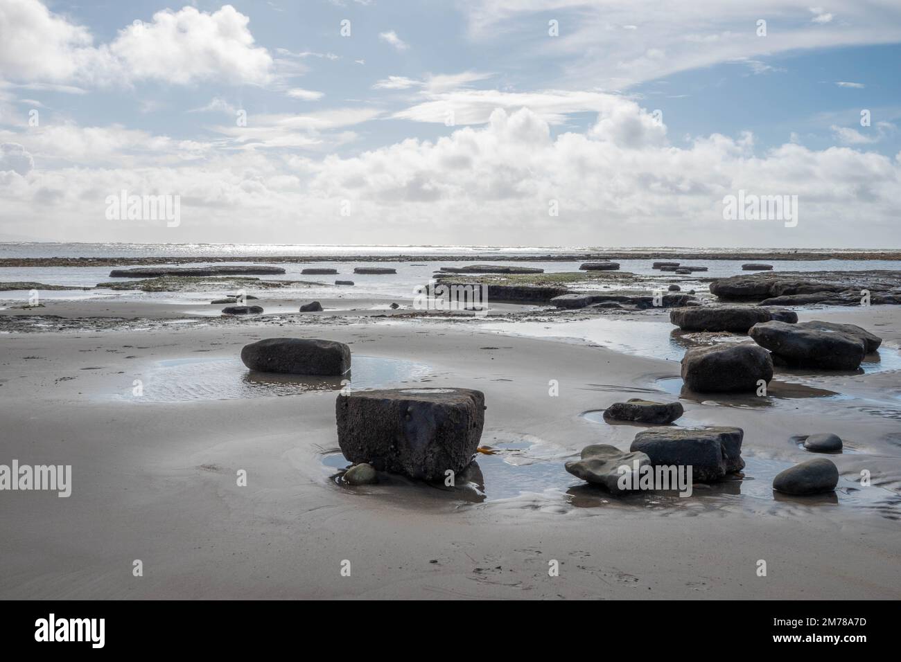 rock pools on a beautiful deserted sandy beach in Lyme Regis Dorset ...