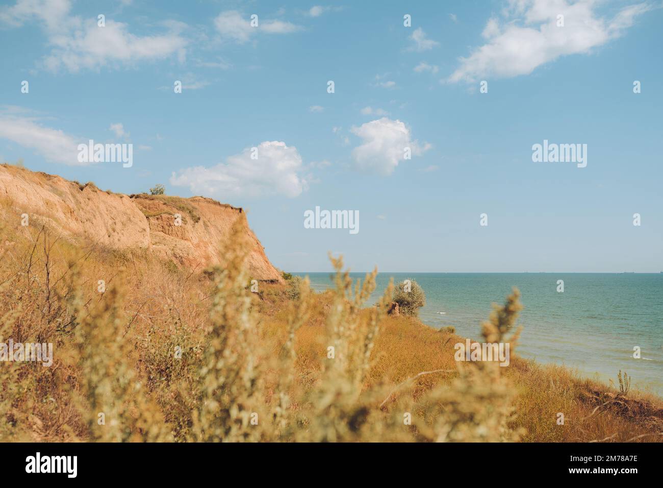 Amazing landscape with sea bay, sand beach and coastal hills and rocks ...