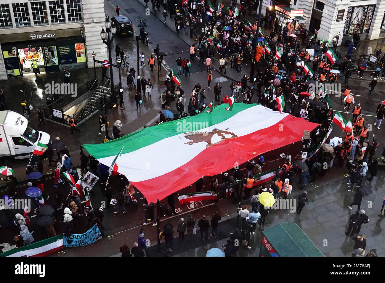 Demonstrators march through Piccadilly Circus in London, to protest ...