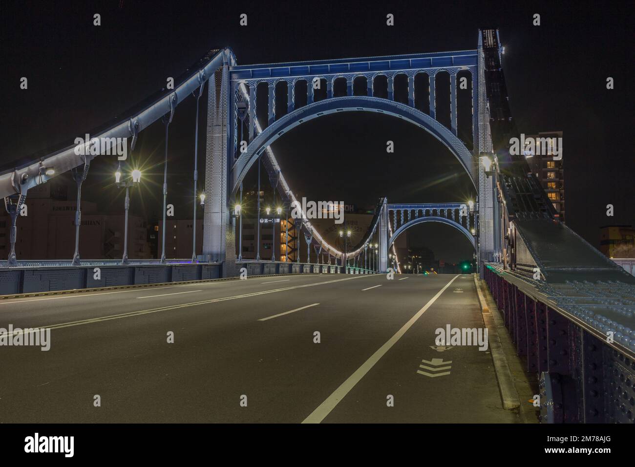 Night view of the Kiyosuhashi Bridge over the Sumidagawa river, with ...