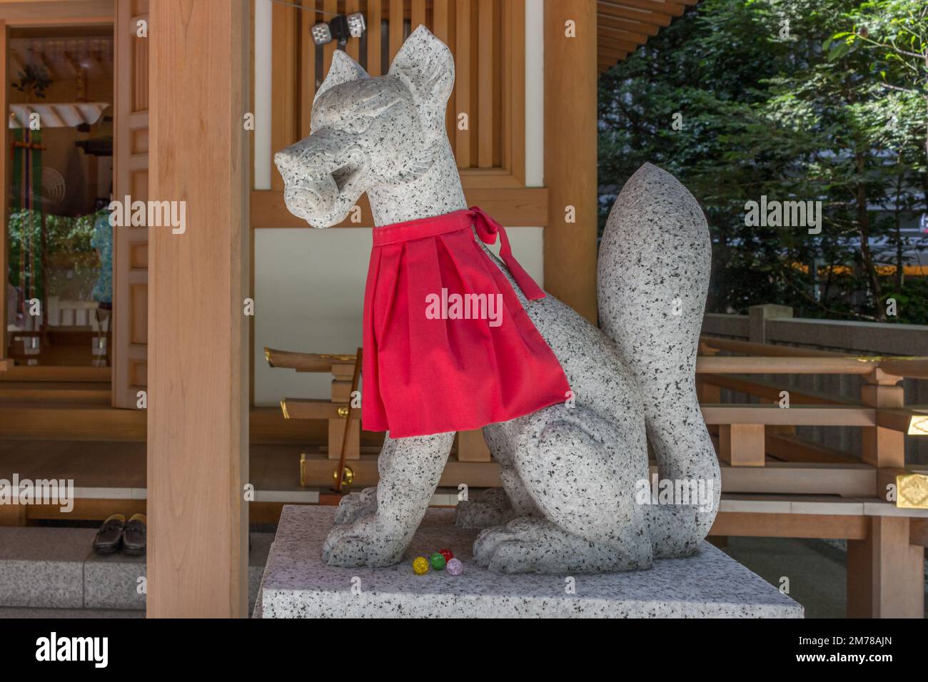 Stone fox, known in Japanese as "kitsune", messenger of the god inari ...