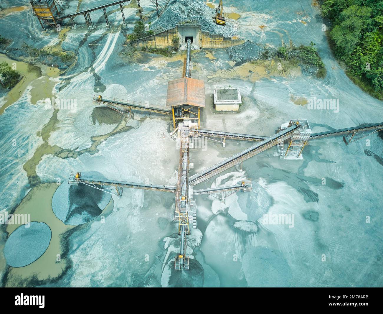 Stone crushing system at open pit mining quarry Stock Photo - Alamy