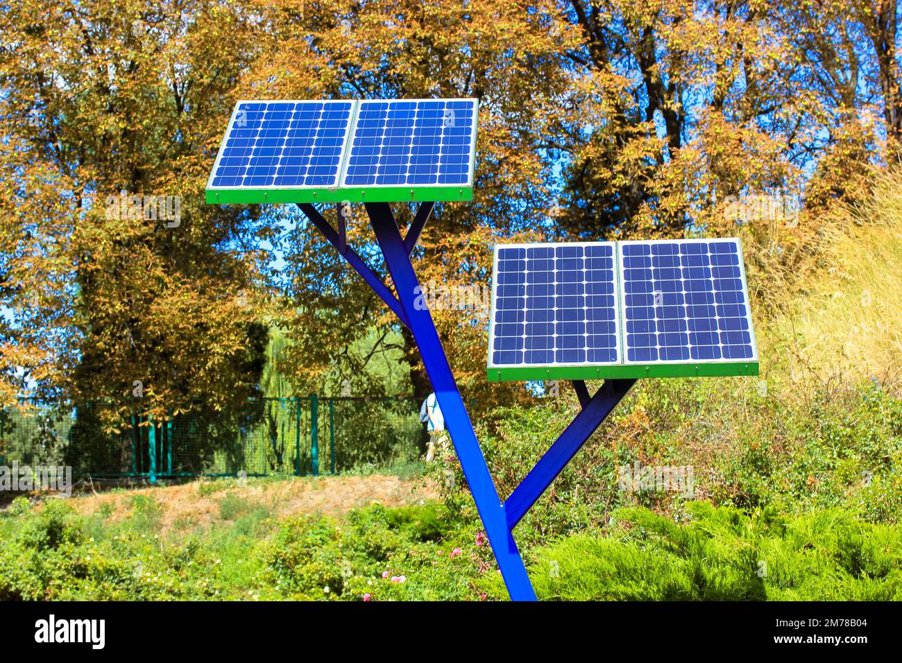 Small solar power array panels installed in a city park for charging ...