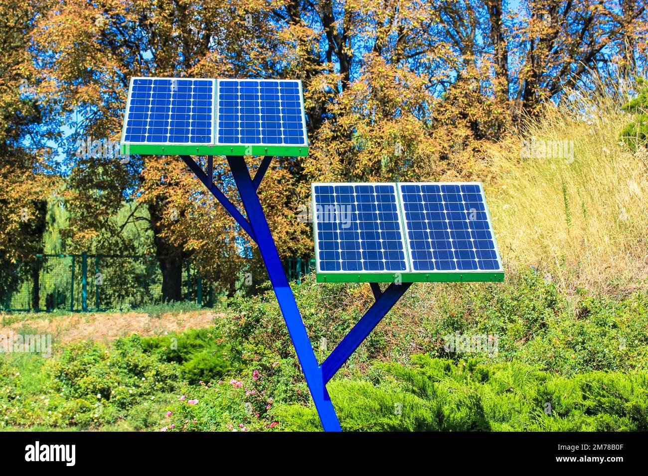 Small solar power array panels installed in a city park for charging ...