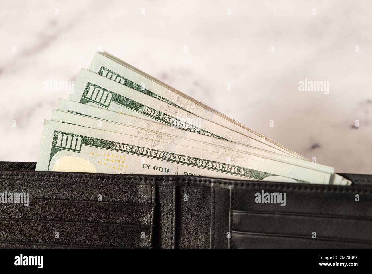 banknote money dollars in a wallet on a light background, the concept ...