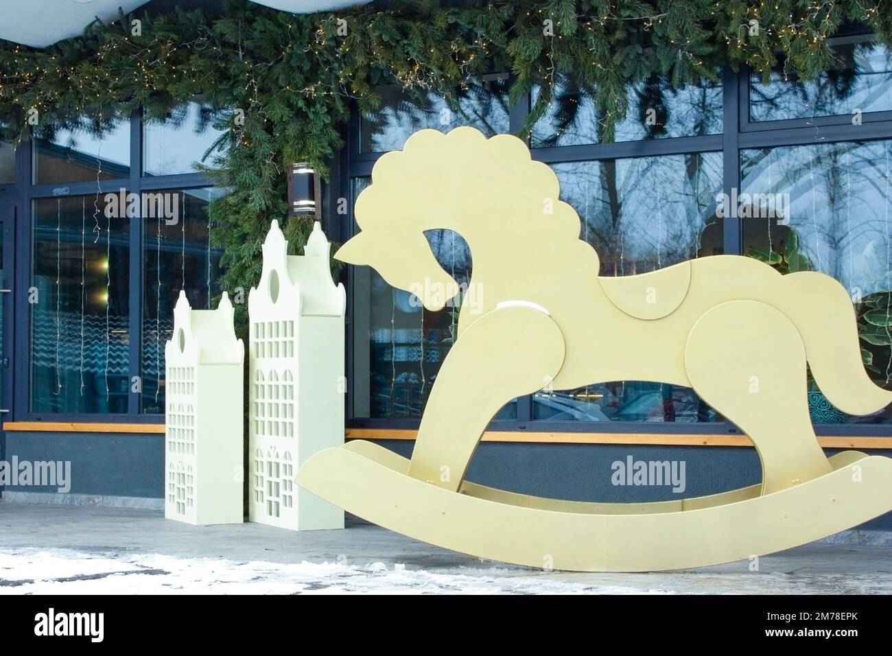 Christmas backdrop with wooden toys and decorated cafe window. Wooden ...
