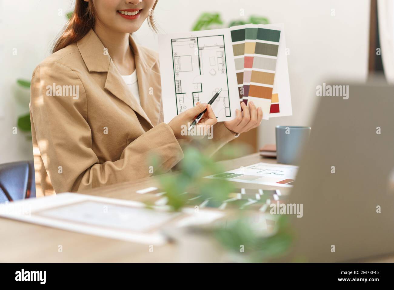 Architectural concept, Female architect presenting house interior ...