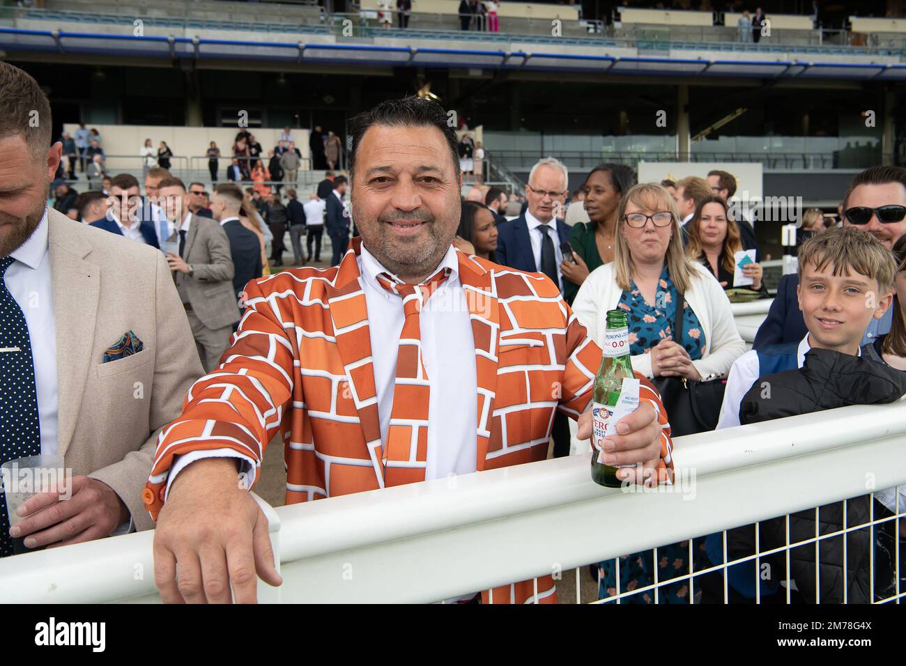 Ascot, Berkshire, UK. 7th May, 2022. A racegoer wears a brick patterned ...