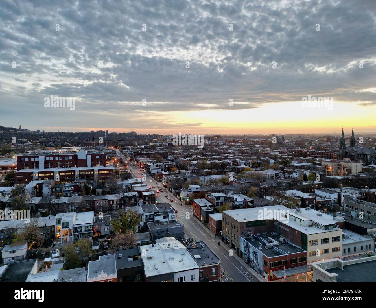 A drone shot of the residential building in Montreal city at sunset ...