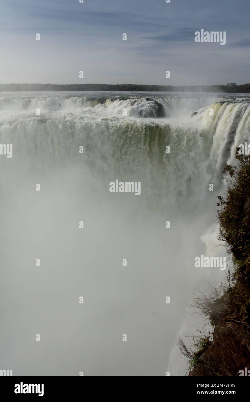 A landscape scene of Devil's Throat waterfalls in Argentina, with ...