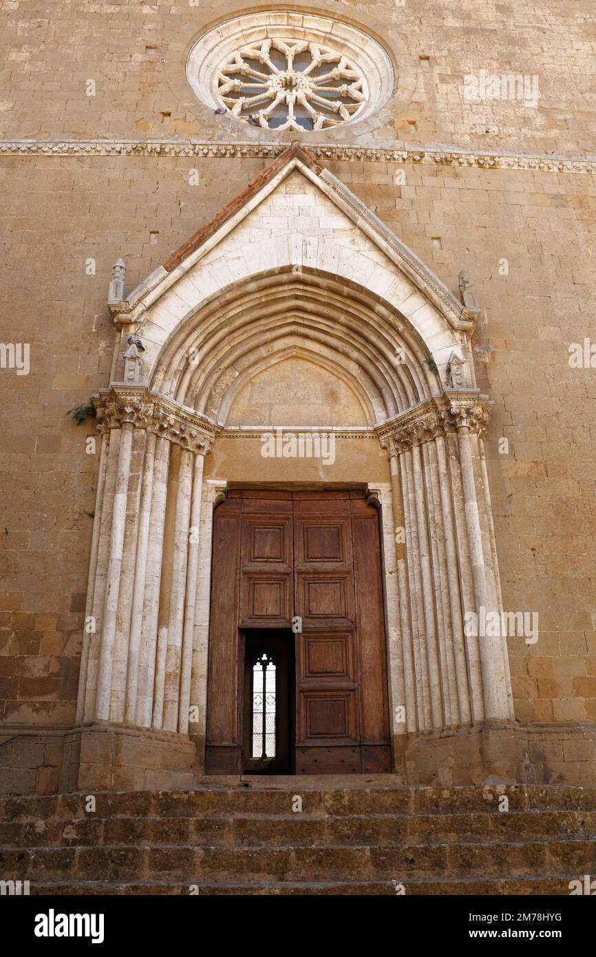 Portal of the romanic-gothic Church Santi Leonardo e Cristofero in the medieval village ...