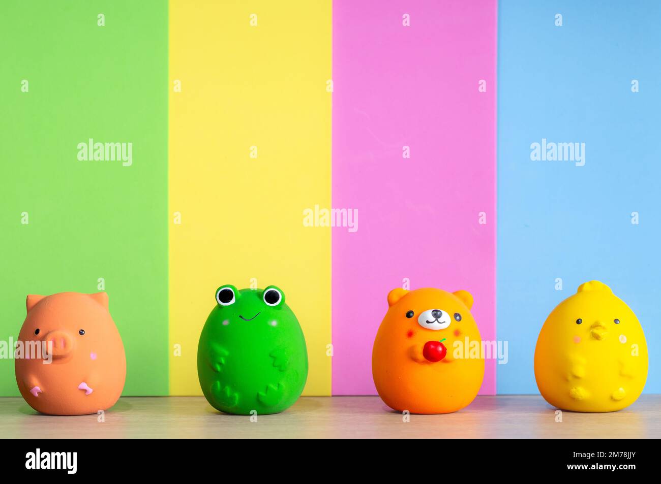 A row of generic soft toys representing farm animals and wildlife to ...