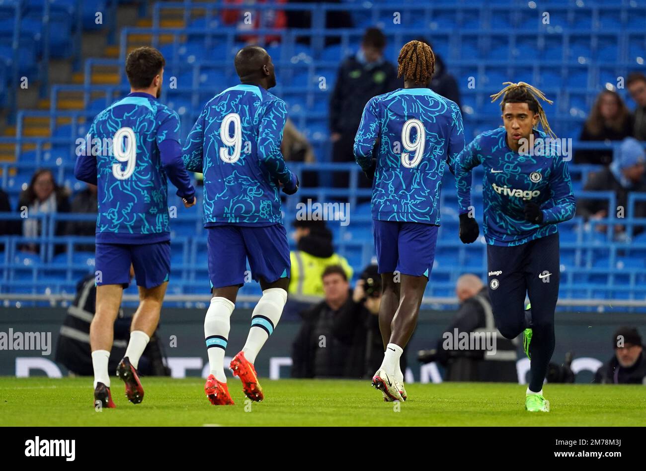Chelsea players warm up on the pitch wearing number 9 on their tops in ...