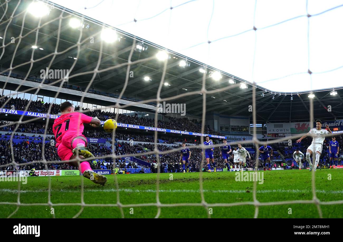 Cardiff City goalkeeper Jak Alnwick (left) makes a save from Leeds ...