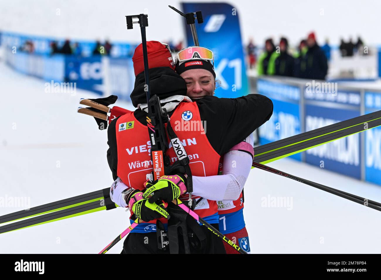 Pokljuka, Slovenia. 08th Jan, 2023. Amy Baserga hugs teammate Niklas ...