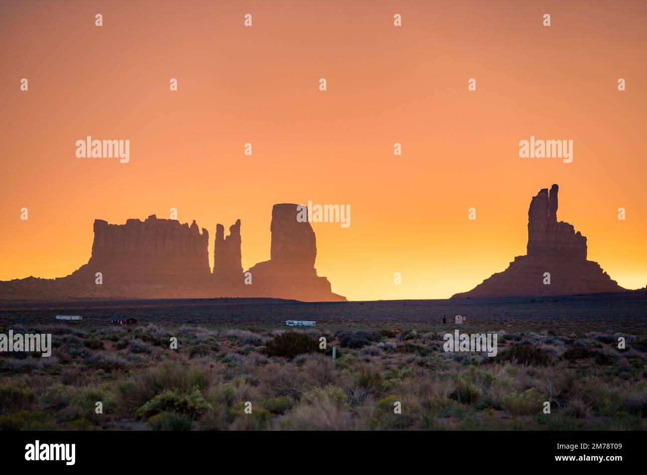 silhouette of buttes in monument valley during sunrise Stock Photo - Alamy
