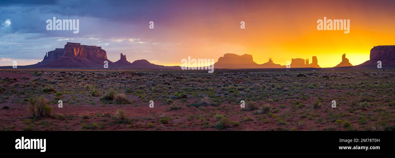 great panorama view of during rainy sunrise in monument valley Stock ...