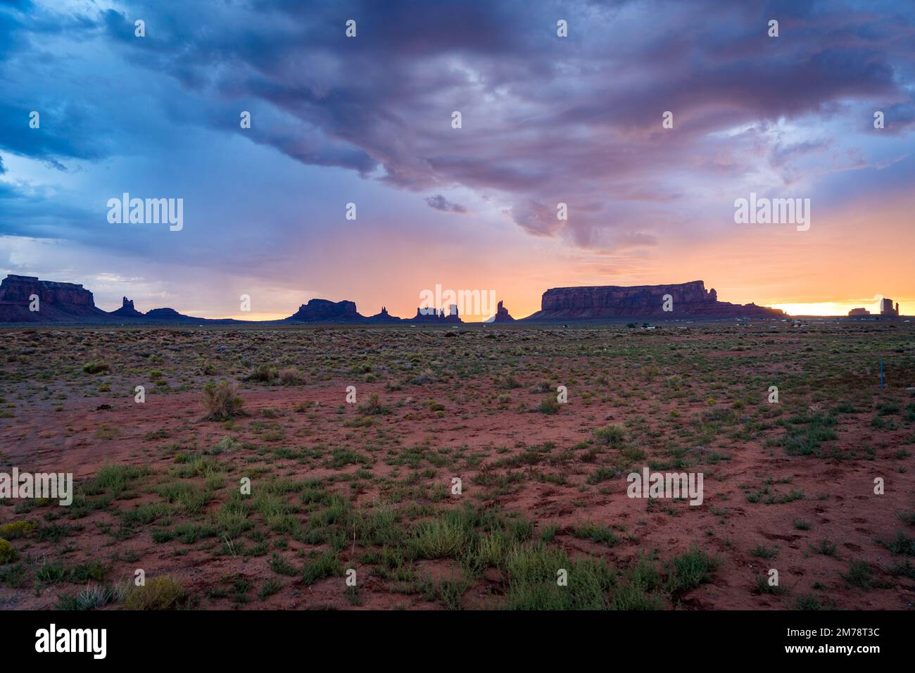 sunrise and rain over monument valley desert Stock Photo - Alamy