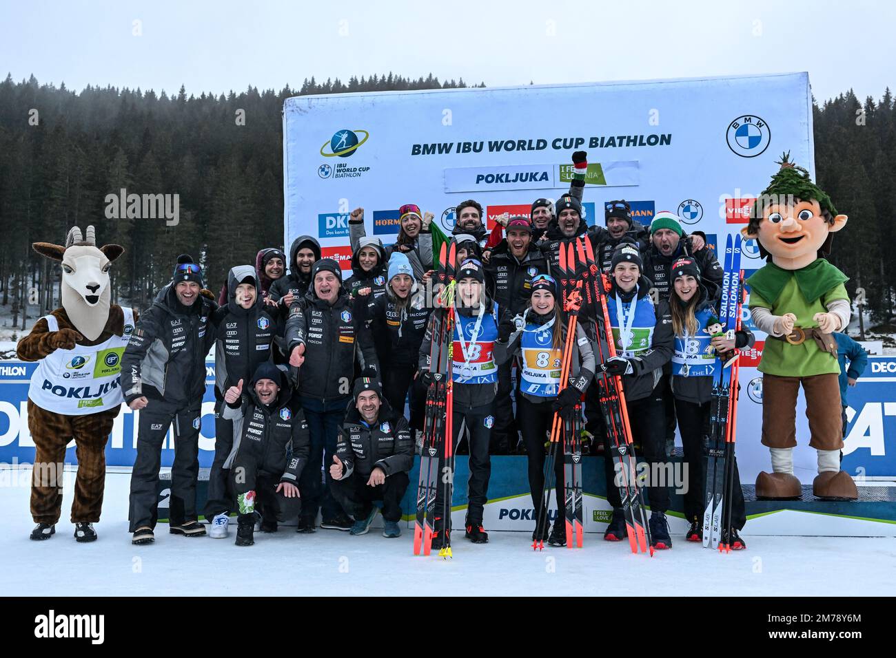 Italian team pose on the podium after finish second on the Mixed Relay ...