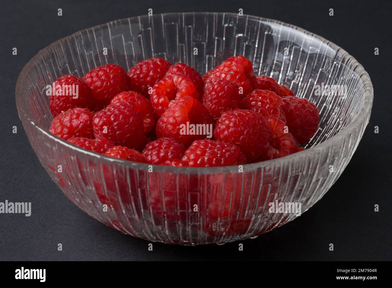 A Glass Bowl of Raspberries Stock Photo - Alamy
