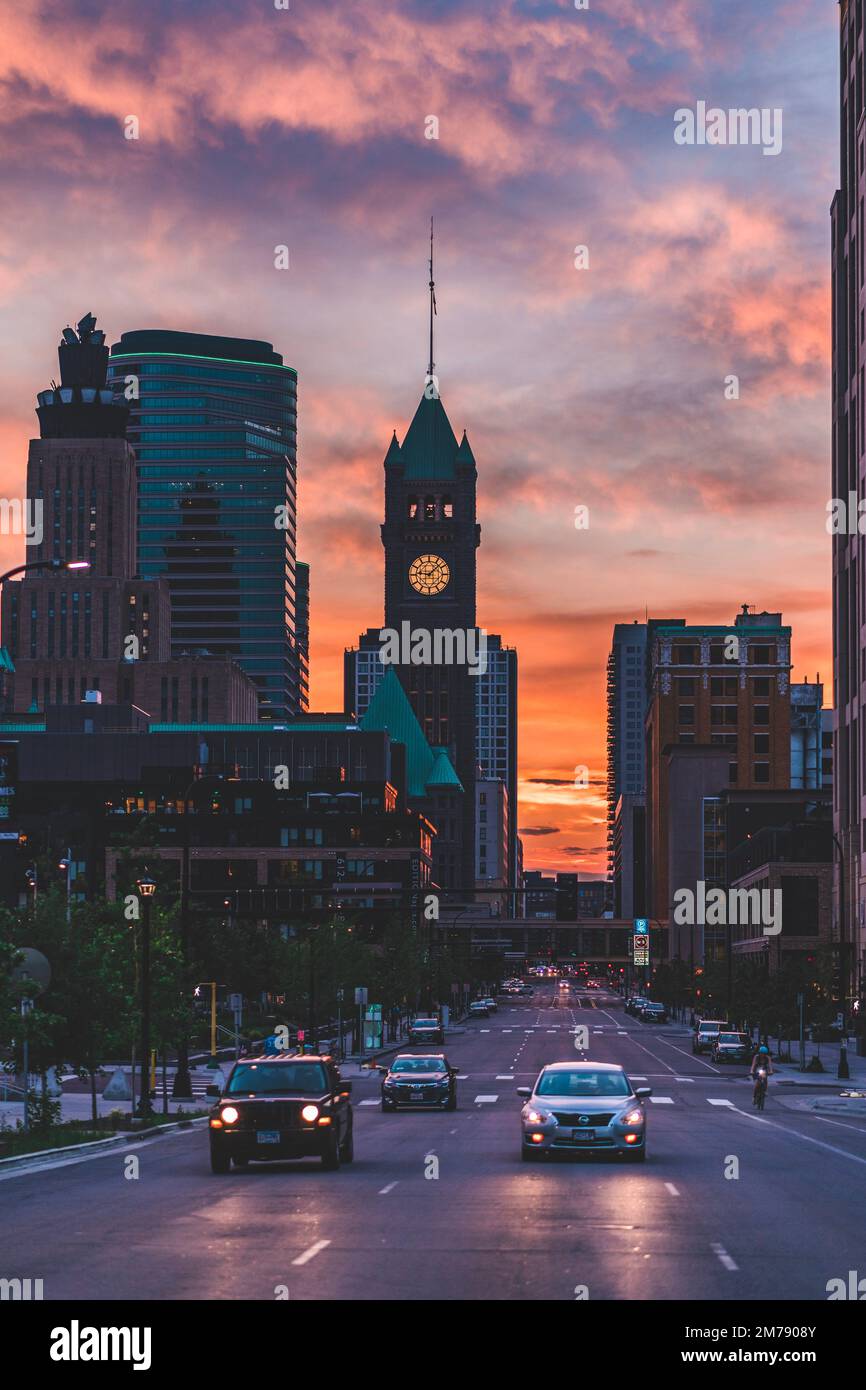 A picturesque pink color sunset sky over the Minneapolis clock tower ...