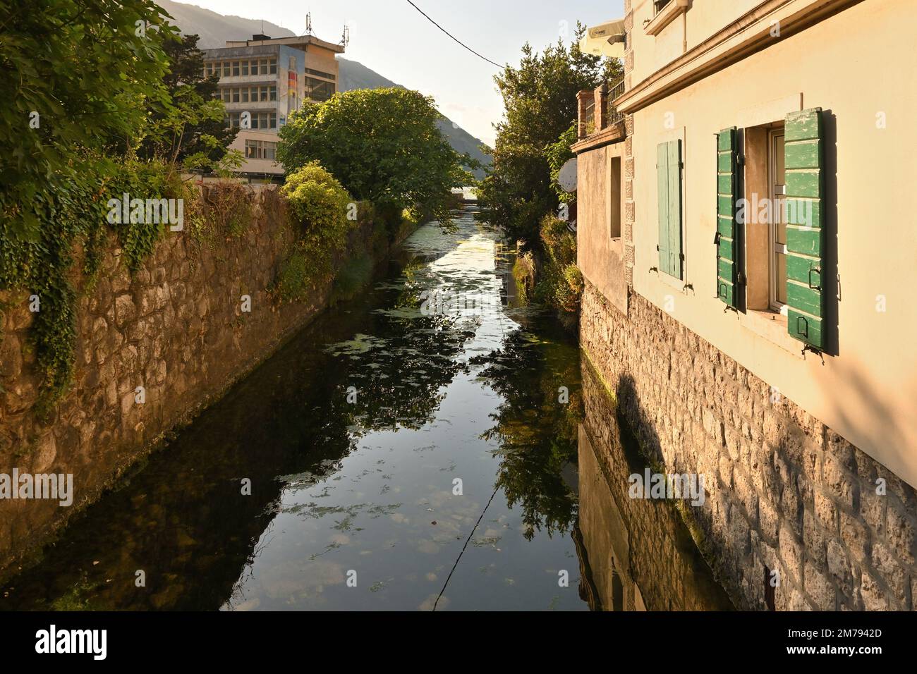 Traditional Montenegrin architecture by the canal leading to the Bay of ...