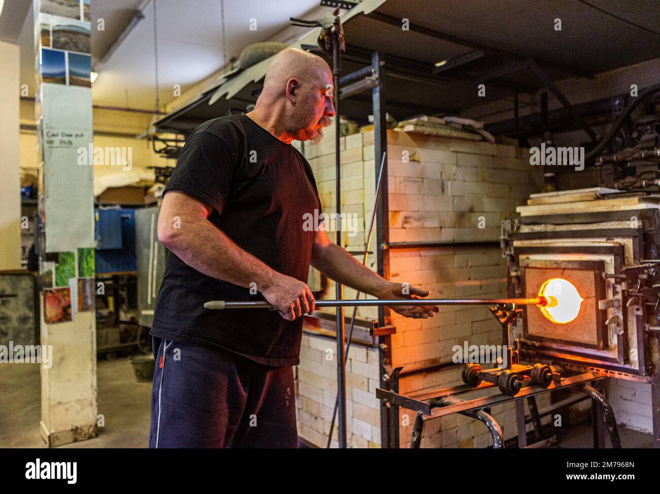 Glass blower working at a furnace in workshop Stock Photo - Alamy
