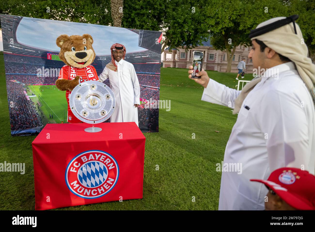 Doha, Qatar. 08th Jan, 2023. Two men stand next to the FCB mascot ...