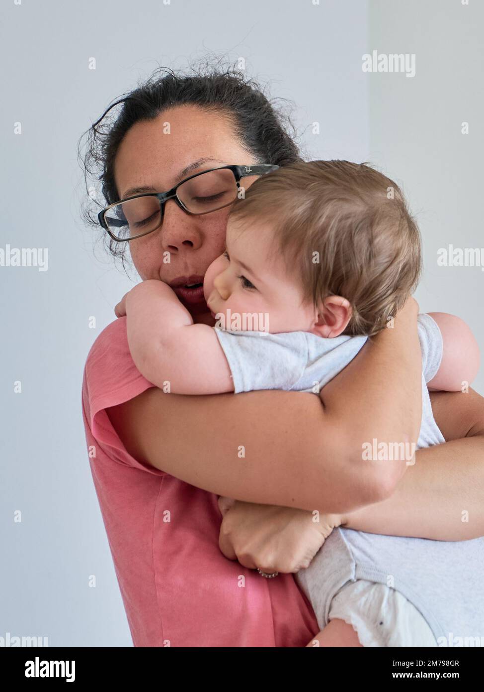 mom hugging her baby boy Stock Photo - Alamy
