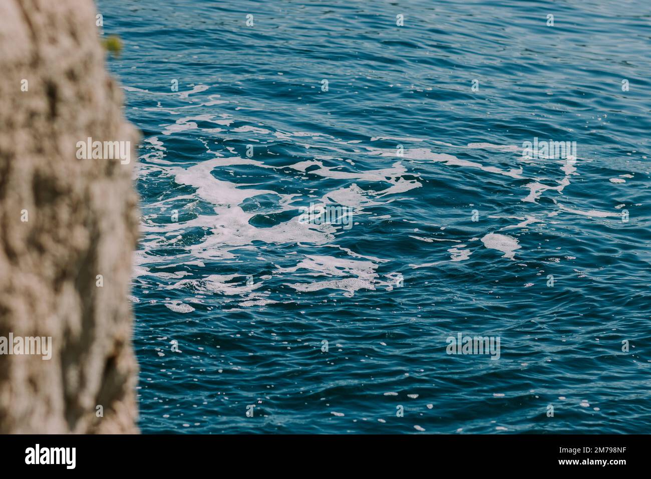 Summer coastline near an island on the deep blue ocean Stock Photo - Alamy