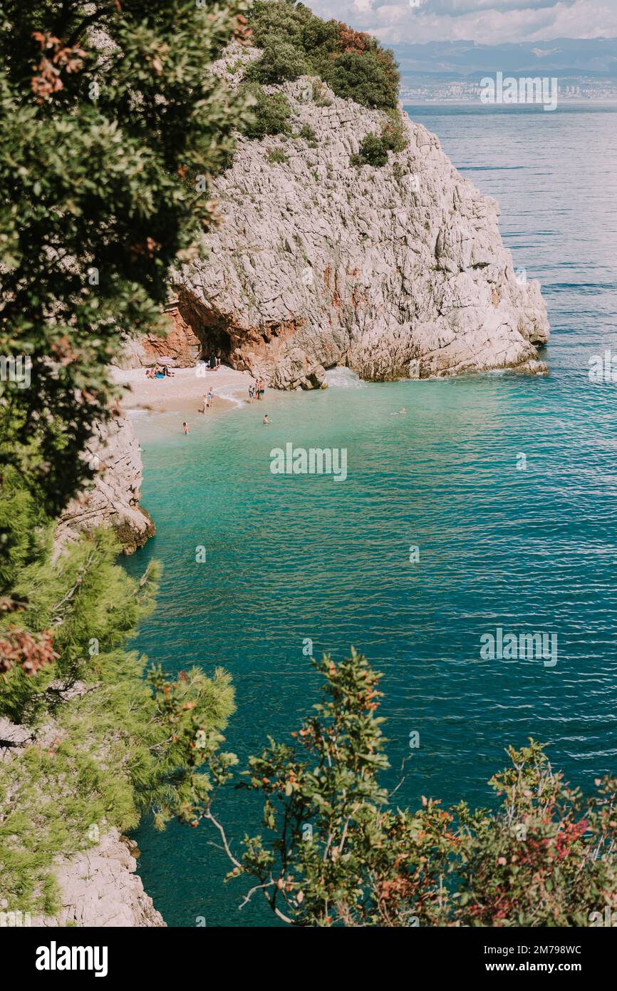 Summer coastline near an island on the deep blue ocean Stock Photo - Alamy