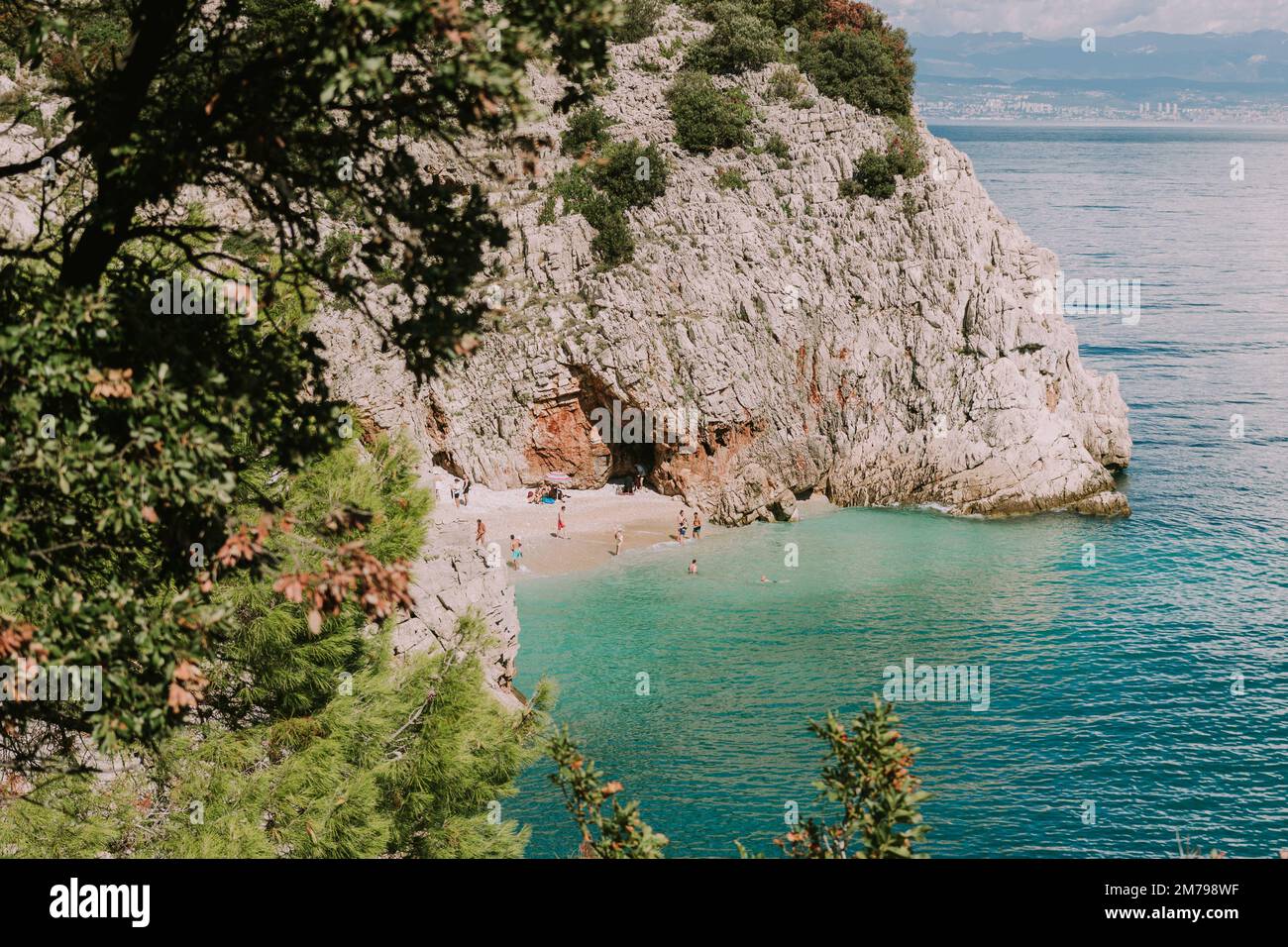 Summer coastline near an island on the deep blue ocean Stock Photo - Alamy